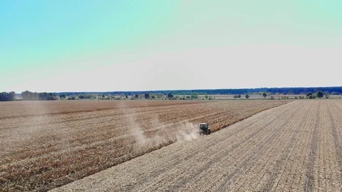 Aerial top view. tractor cuts dry corn s... | Stock Video | Pond5