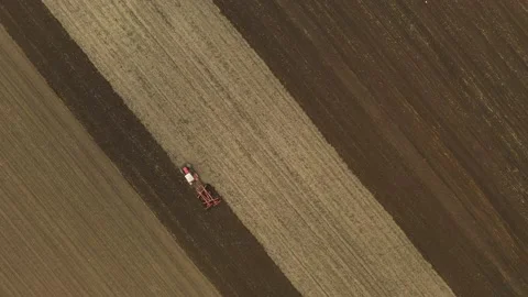 Aerial top view of tractor as dragging a... | Stock Video | Pond5