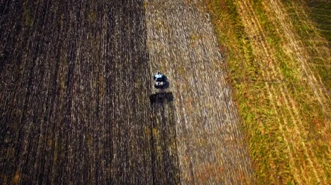 Aerial top view of tractor plowing the s... | Stock Video | Pond5