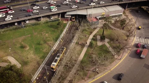 Aerial - Top view of yellow tram arrivin... | Stock Video | Pond5