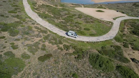 Aerial tracking shot of a camper van arr... | Stock Video | Pond5