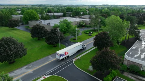 Aerial tracking shot of Fedex 18 wheeler... | Stock Video | Pond5