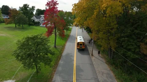 Aerial tracking shot of school bus drivi... | Stock Video | Pond5