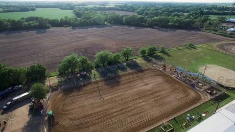 Aerial tractor rakes arena in preparatio... | Stock Video | Pond5