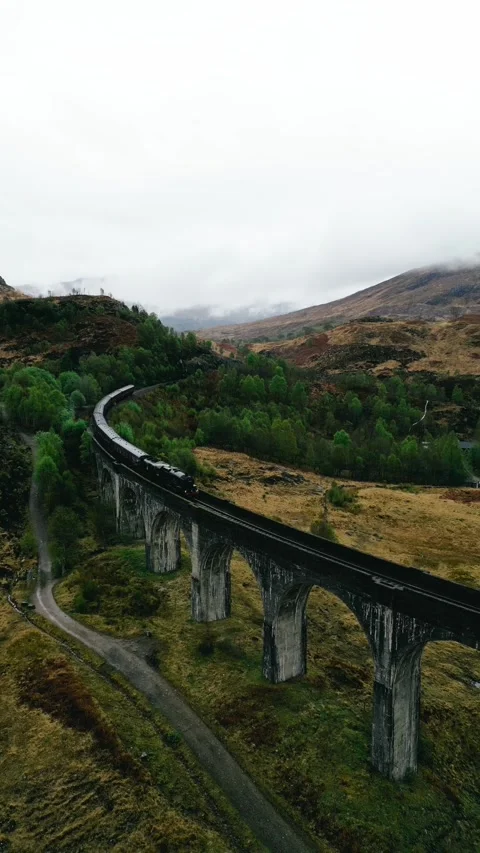 Aerial of a train on the Glenfinnan Viad... | Stock Video | Pond5