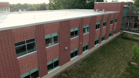 Aerial of two story brick school buildin... | Stock Video | Pond5
