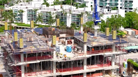Aerial video construction workers in mot... | Stock Video | Pond5