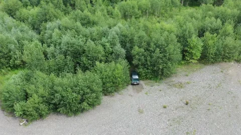 Aerial view of a 4x4 SUV driving on a di... | Stock Video | Pond5