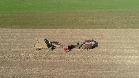 Aerial View of an Amish Man and Woman Ha... | Stock Video | Pond5