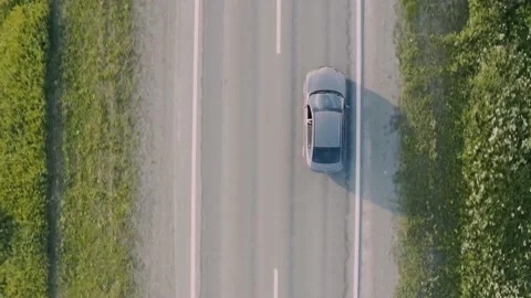 Aerial view of a car driving on the road... | Stock Video | Pond5