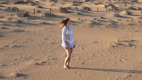 Aerial View of Drone Model Poses on Sand... | Stock Video | Pond5