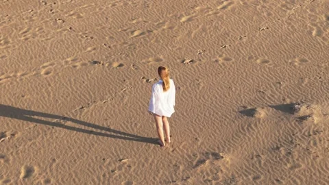 Aerial View of Drone Model Poses on Sand... | Stock Video | Pond5