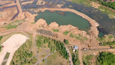 Aerial view of dug pond at a constructio... | Stock Video | Pond5