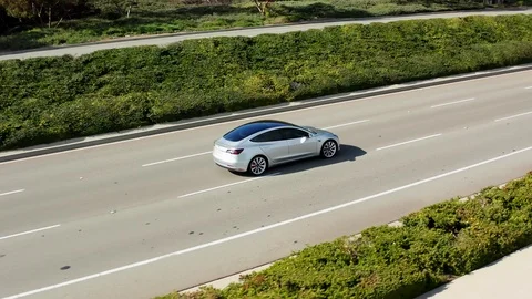 Aerial view of an electric vehicle or EV... | Stock Video | Pond5