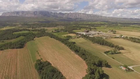 Aerial view of farm field with big farm ... | Stock Video | Pond5