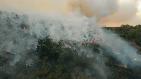 Aerial view at fire at garbage dump, bur... | Stock Video | Pond5
