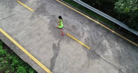 Aerial view of fitness woman runner runn... | Stock Video | Pond5
