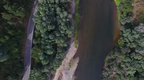 aerial view following road and river sid... | Stock Video | Pond5