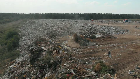 Aerial view at garbage dump, tractor and... | Stock Video | Pond5