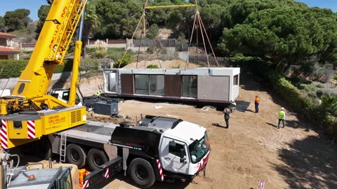 Aerial view heavy crane lifting smart mo... | Stock Video | Pond5