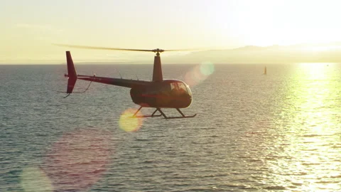 Aerial view of helicopter flying over oc... | Stock Video | Pond5