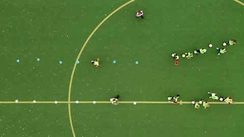 Aerial view of kids playing football on ... | Stock Video | Pond5