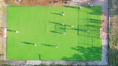 Aerial view of kids playing football in ... | Stock Video | Pond5