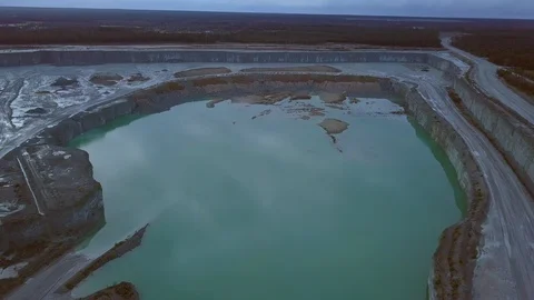 Aerial view of limestone quarry and pond... | Stock Video | Pond5