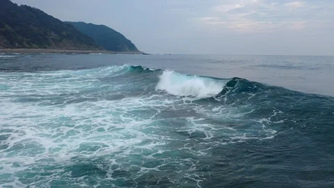 Aerial view of long ocean wave in shape ... | Stock Video | Pond5