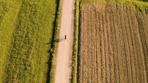 Aerial view of man riding touring bicycl... | Stock Video | Pond5