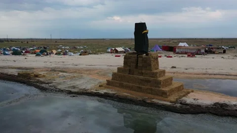 Aerial view on a Moai statue on the shor... | Stock Video | Pond5