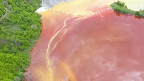Aerial view of orange toxic waste water ... | Stock Video | Pond5