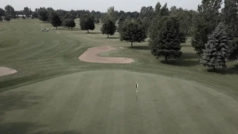 Aerial view over a golf course putting g... | Stock Video | Pond5
