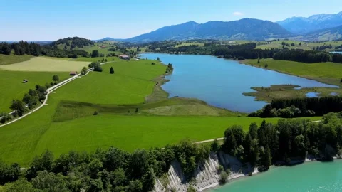 Aerial view over Lake Forggensee at the ... | Stock Video | Pond5