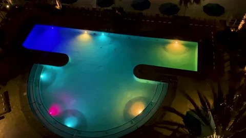 Aerial view of a party pool, flashing li... | Stock Video | Pond5