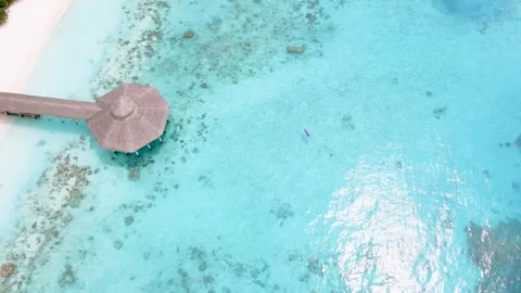 Aerial view of pier and boardwalk on blu... | Stock Video | Pond5