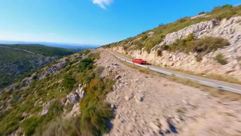 Aerial view of a Red Ferrari driving alo... | Stock Video | Pond5