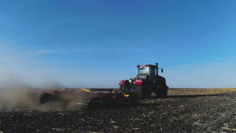 Aerial view of a red tractor with harrow... | Stock Video | Pond5