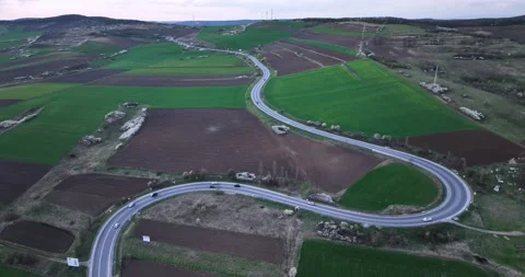 Aerial View of a rural curved road in Ro... | Stock Video | Pond5