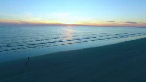 Aerial view of sea, beach and relaxed pe... | Stock Video | Pond5