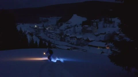 Aerial view of a snowboard riding at nig... | Stock Video | Pond5