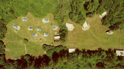 Aerial view of a summer camp with cabins... | Stock Video | Pond5