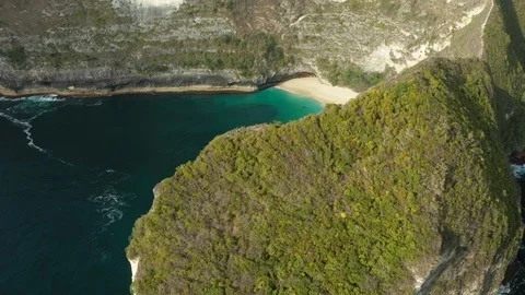 Aerial view of a T-Rex shaped cliffs wit... | Stock Video | Pond5