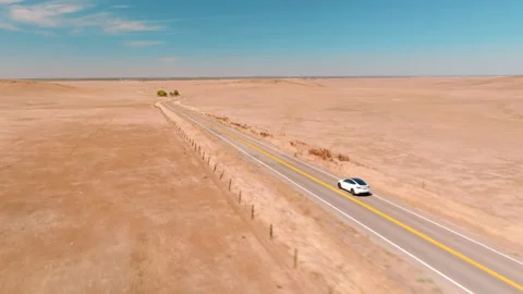 Aerial view of Tesla Model Y driving thr... | Stock Video | Pond5