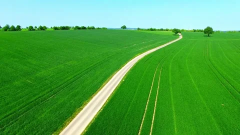 Aerial view of vast farmland on both sid... | Stock Video | Pond5
