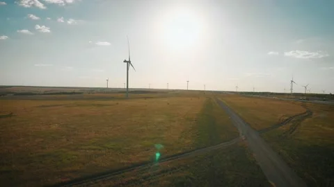 Aerial view of wind turbine on a field i... | Stock Video | Pond5