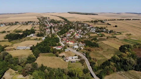 Aerial view of a winding main road passi... | Stock Video | Pond5