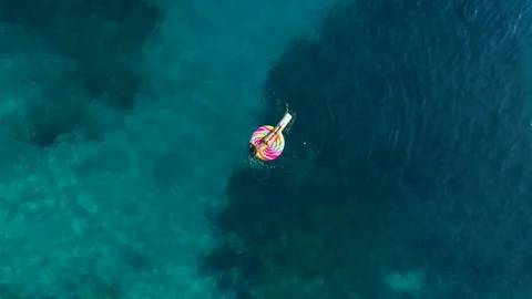 Aerial view of woman floating on inflata... | Stock Video | Pond5