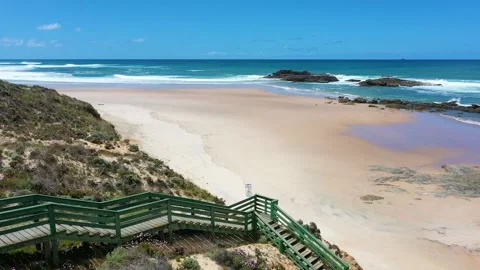 Aerial view of wooden walkway and sandy ... | Stock Video | Pond5