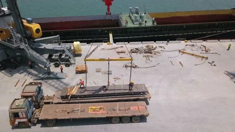 Aerial view of workers unloading a heavy... | Stock Video | Pond5